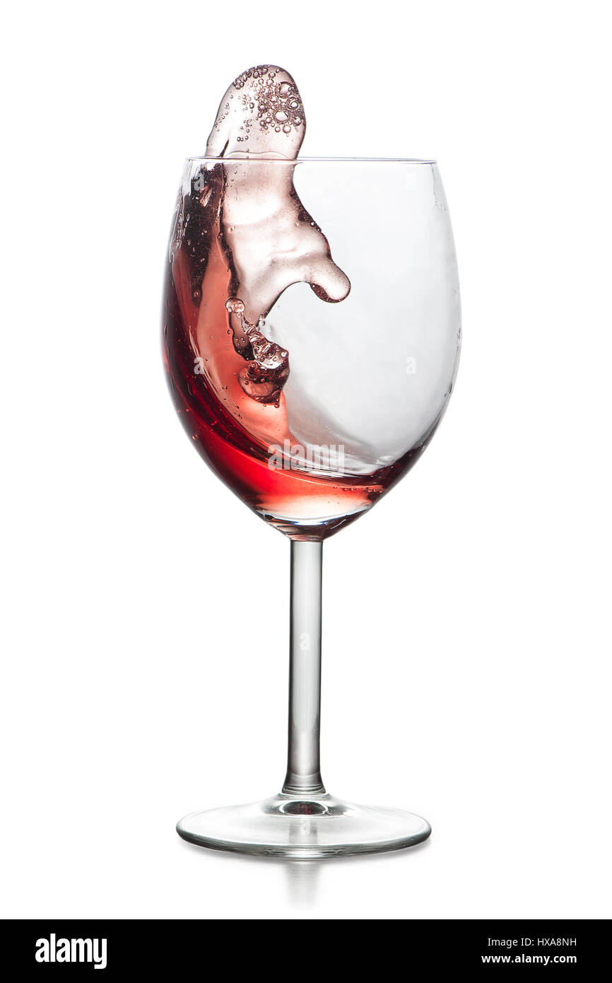 Moving red wine glass over a white background Stock Photo - Alamy