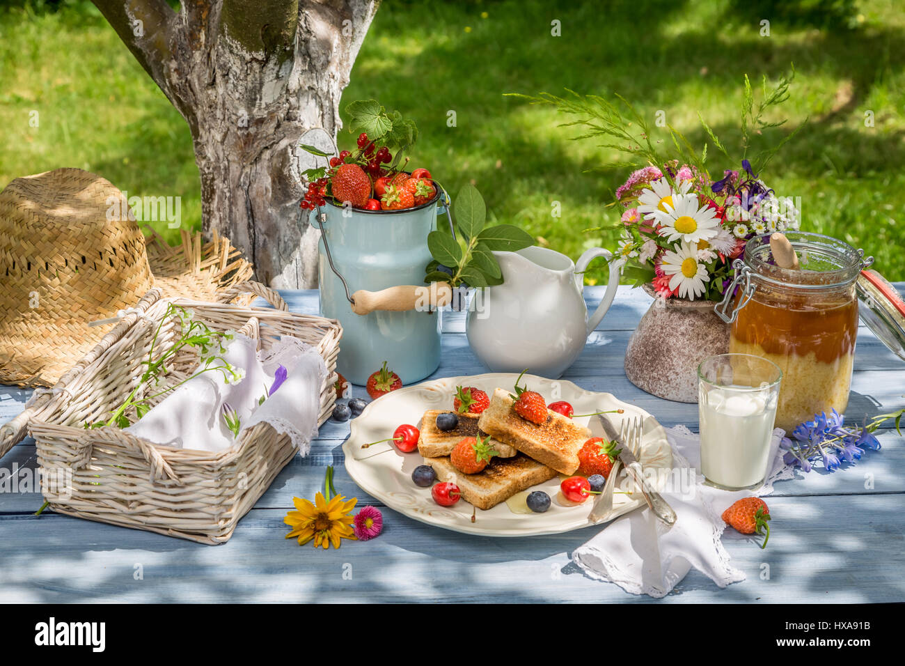 Toast, fruit and honey for breakfast on old wooden table Stock Photo ...