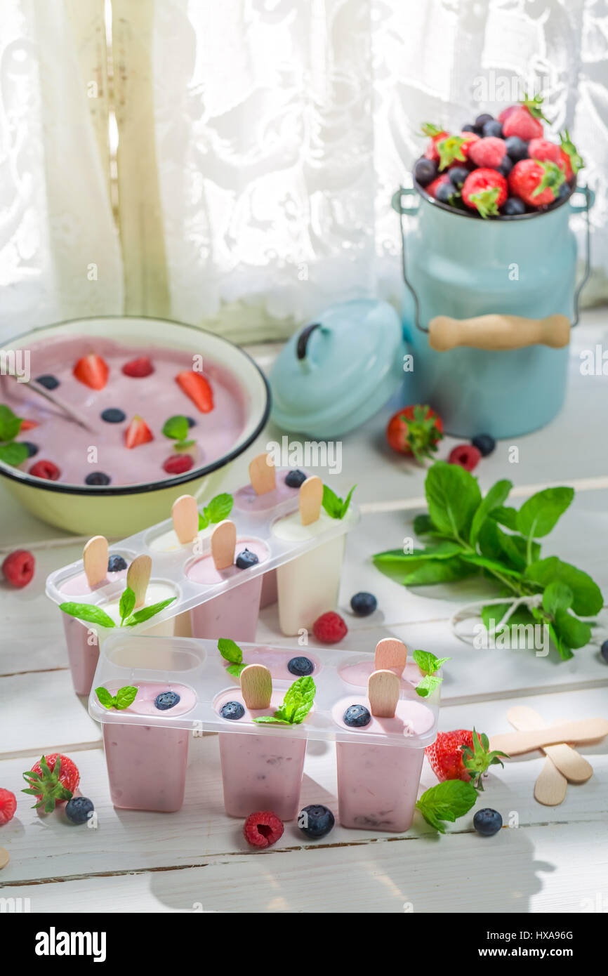 Juicy ice cream with fruits on old white table Stock Photo - Alamy