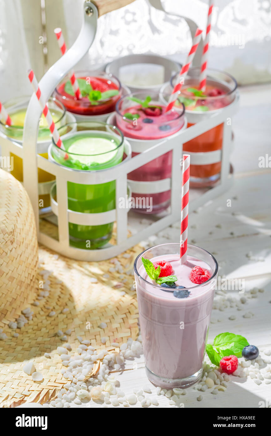 Sweet cocktail with fruity yogurt on old white table Stock Photo - Alamy