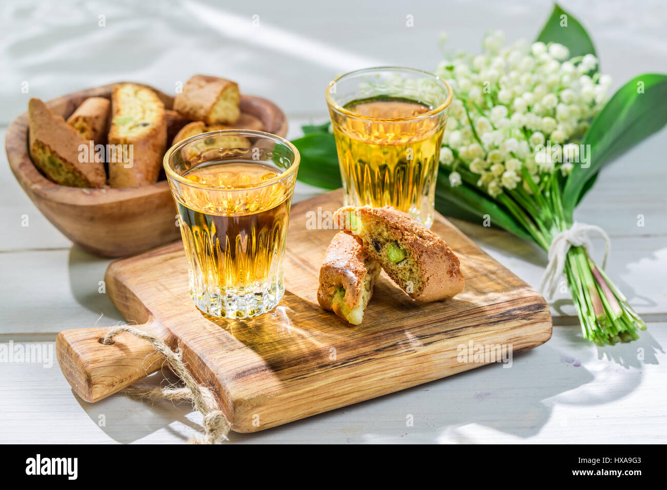 Delicious biscotti with wine on old wooden table Stock Photo - Alamy