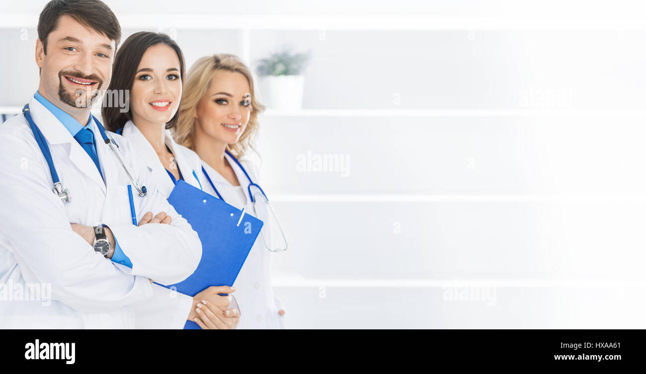 Team of doctors in a clinical office, white copy space Stock Photo - Alamy