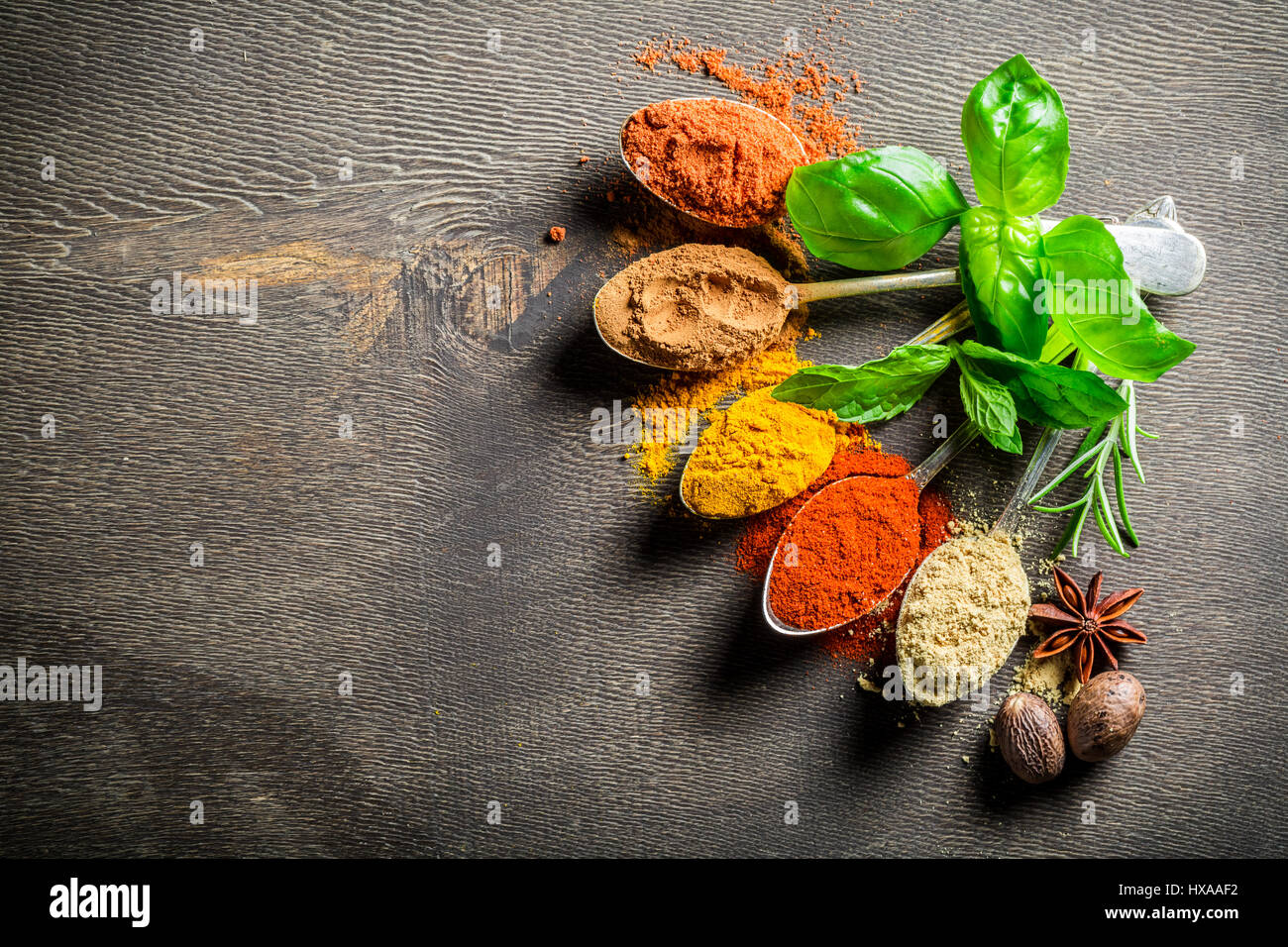 Intensive herbs and spices on old table Stock Photo - Alamy