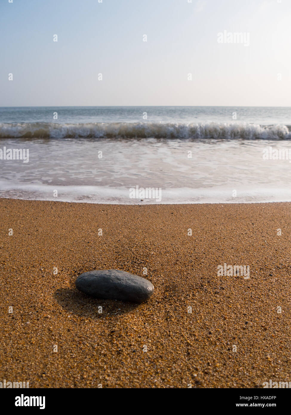 A pebble in the sand of Burton Bradstock beach, Dorset, UK Stock Photo ...