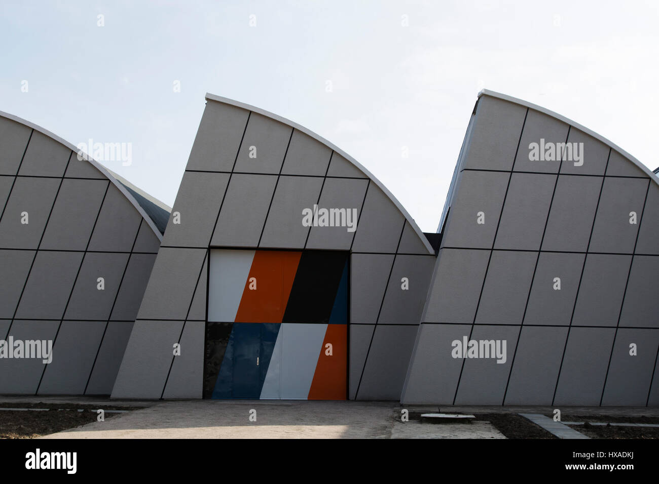 The arched exterior of the De Ploeg factory, designed by Gerrit ...