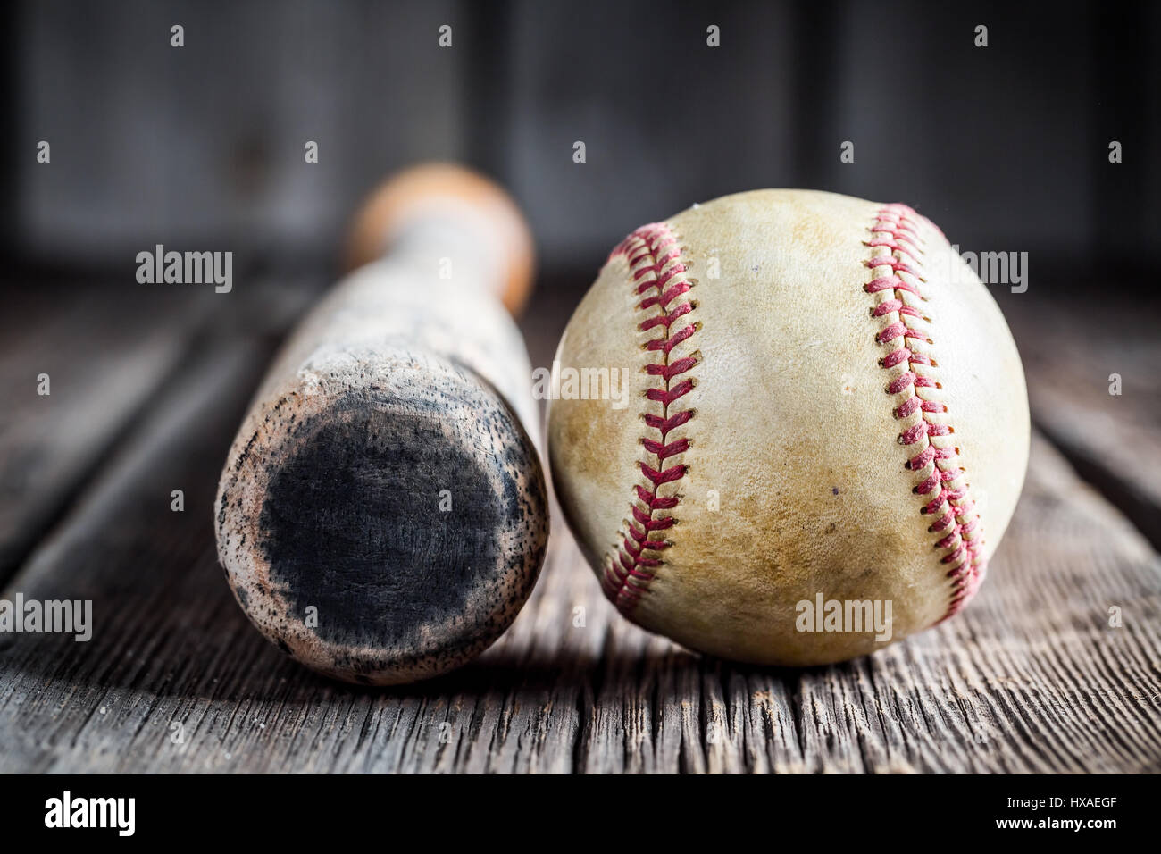 Old baseball bat and Ball on old wooden table Stock Photo - Alamy