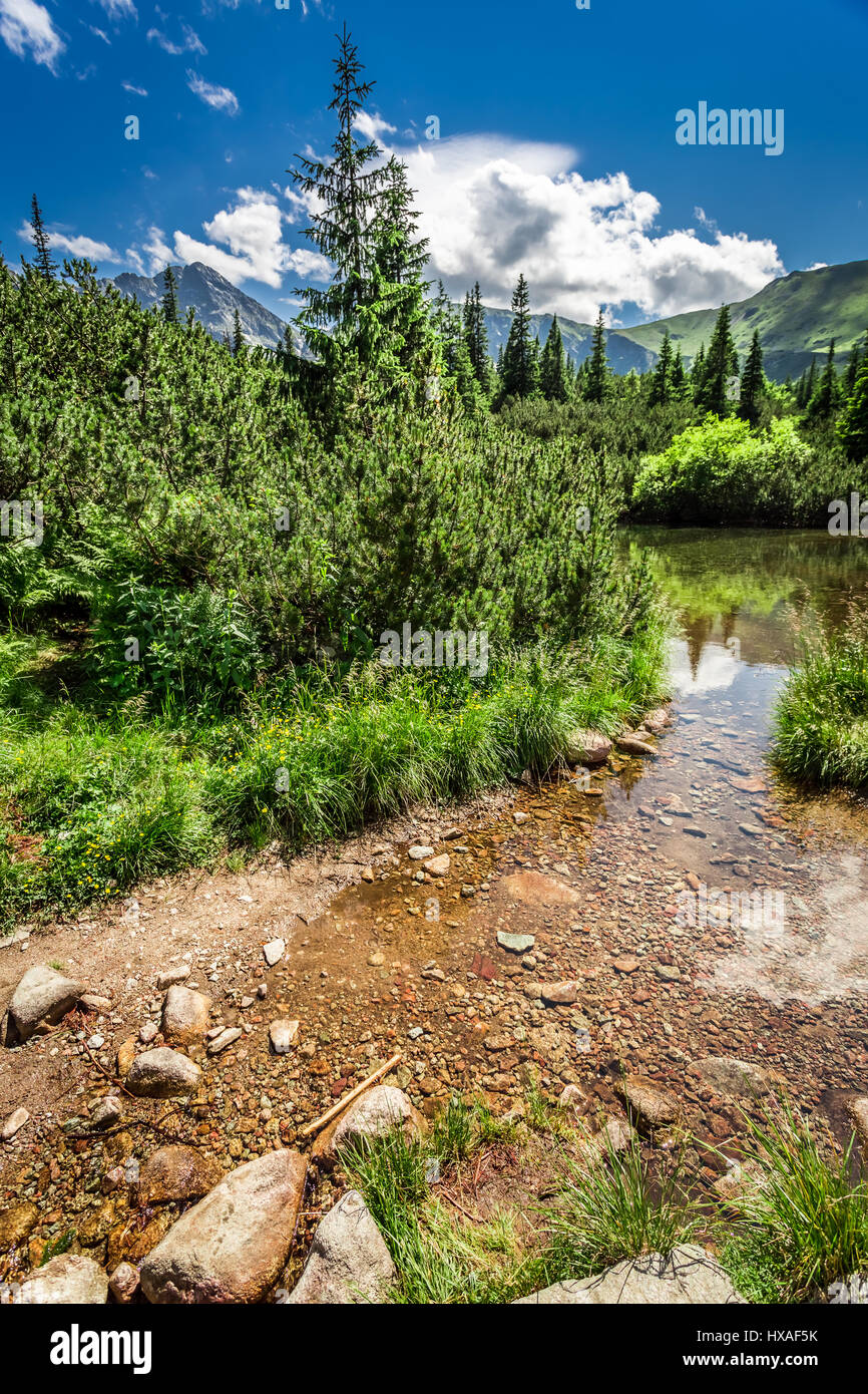 Mountain trail leading to a small village Stock Photo - Alamy
