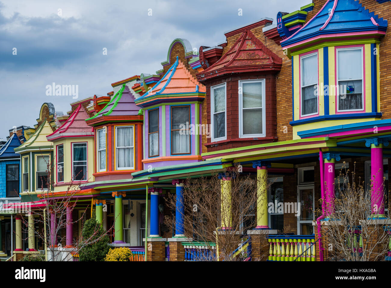 Colorful row houses along Guilford Avenue in Charles Village, Baltimore ...
