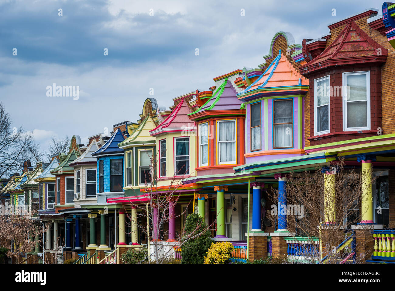 Colorful row houses along Guilford Avenue in Charles Village, Baltimore ...