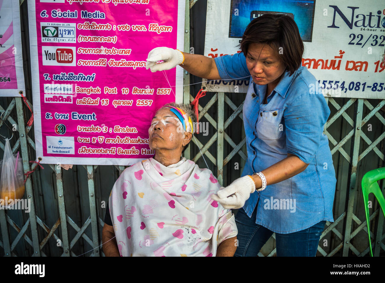 Facial epilation with the ancient method of threading in China town ...