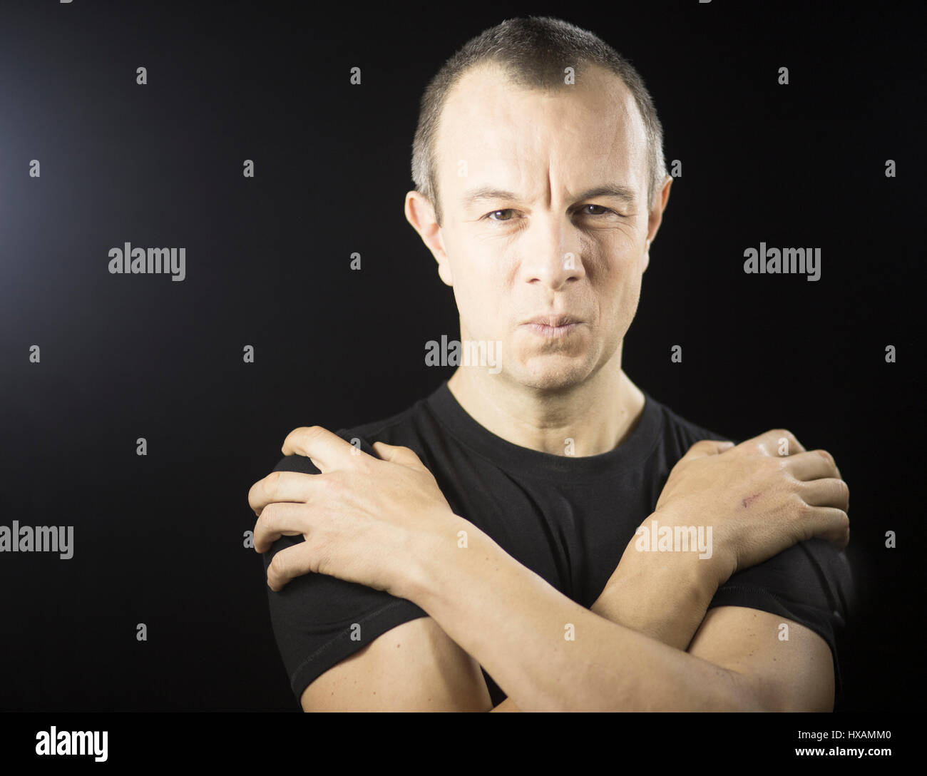 Attractive handsome slim healthy man aged in 40's in black t-shirt ...