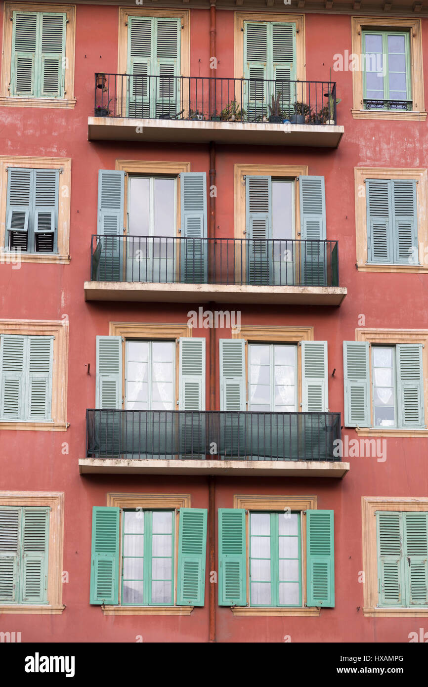 Colourful French shuttered windows and balconies along Rue de Foresta ...