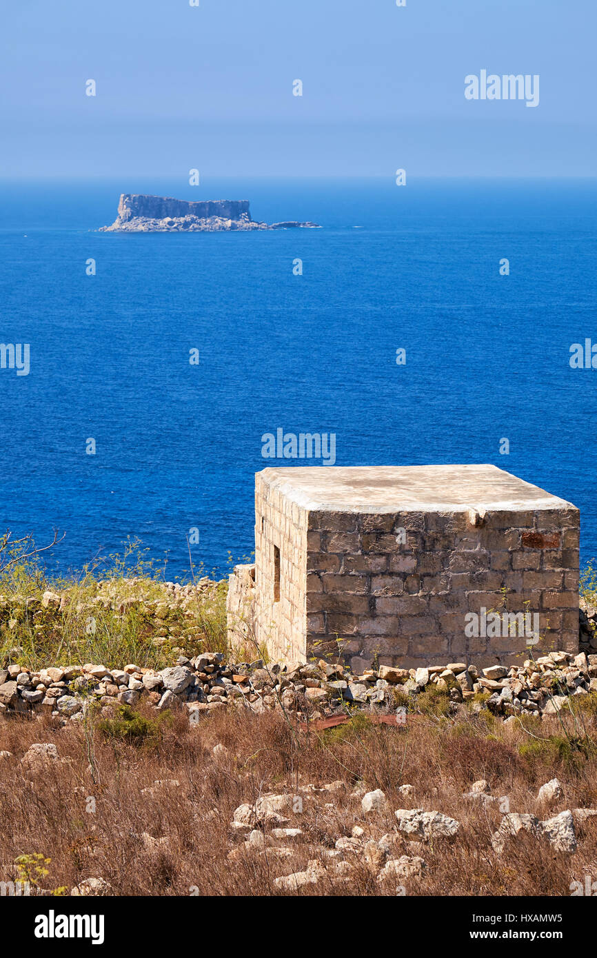 The view of Filfla islet with the guard building midst the the scorched ...
