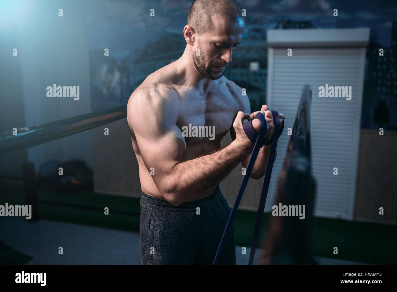 Muscle athlet exercises with elastic band. Active sport lifestyle ...