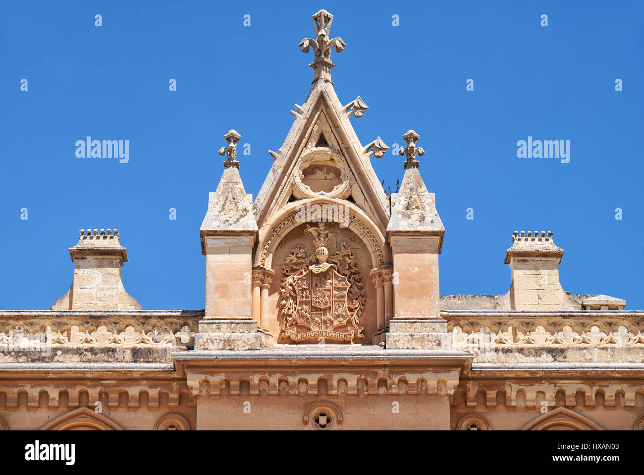 The wimperg (gable) decoreted with coat of arms and crockets above the ...