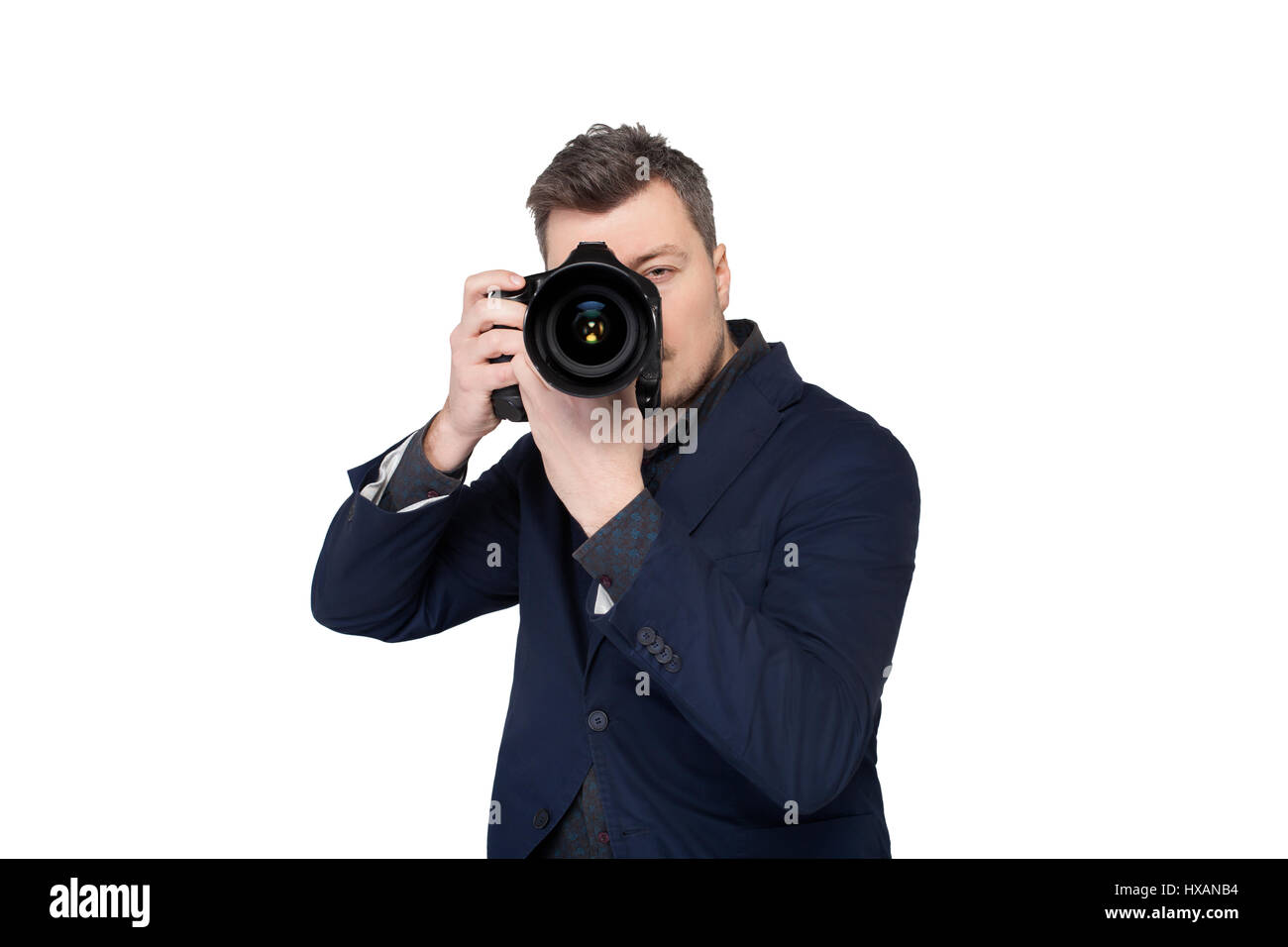 Photographer with digital camera taking picture, front view, white ...