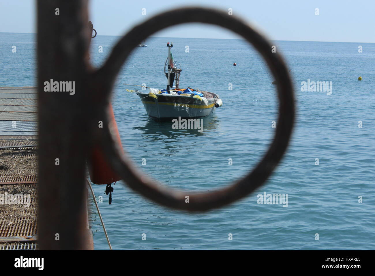 fishing boat through rail Stock Photo - Alamy