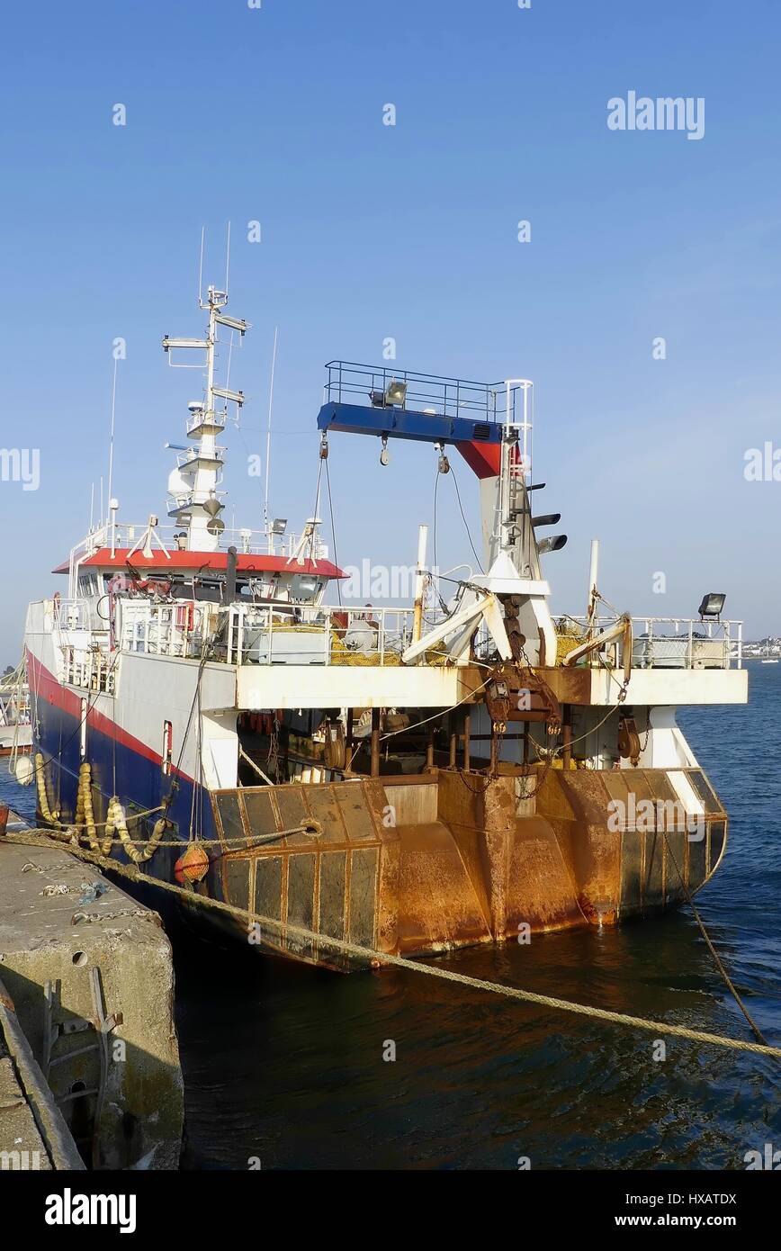 Stern view of Trawler fishing boats with rolled up fishing nets and ...