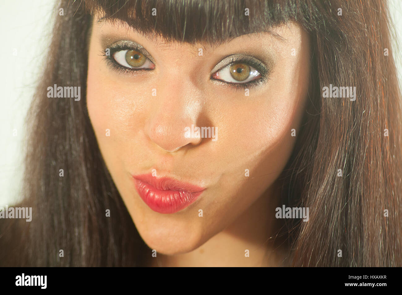 Young woman looking camera and making gestures. Close view Stock Photo ...