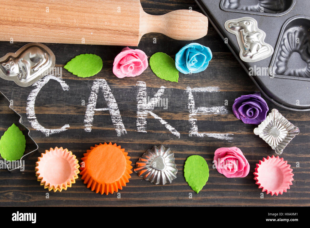 Word Cake Written in Chalk, with Accessories for Cakes Stock Photo - Alamy