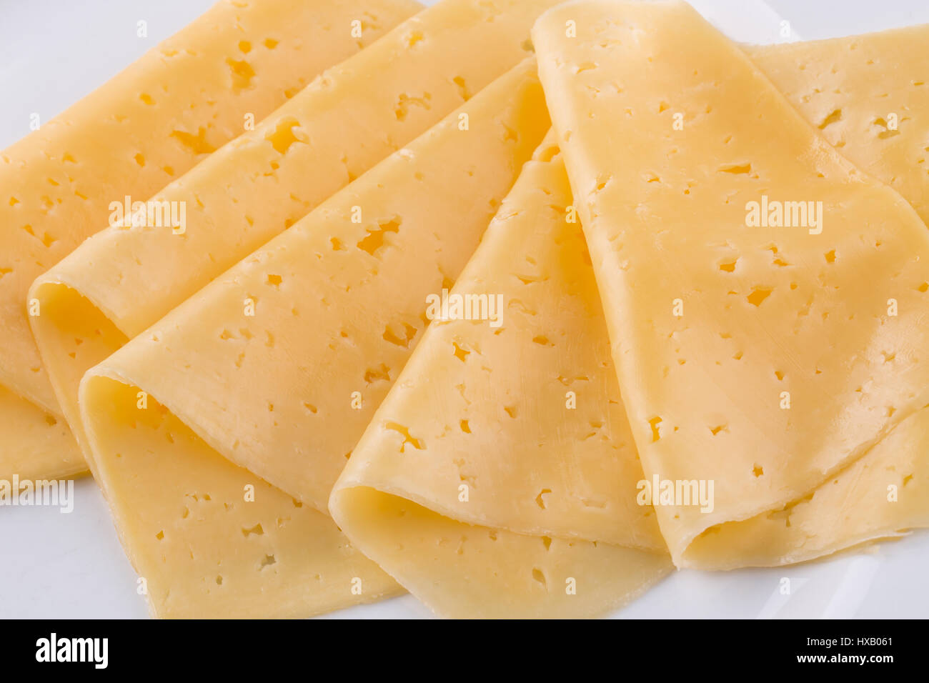 cheese slices isolated on a white background Stock Photo - Alamy
