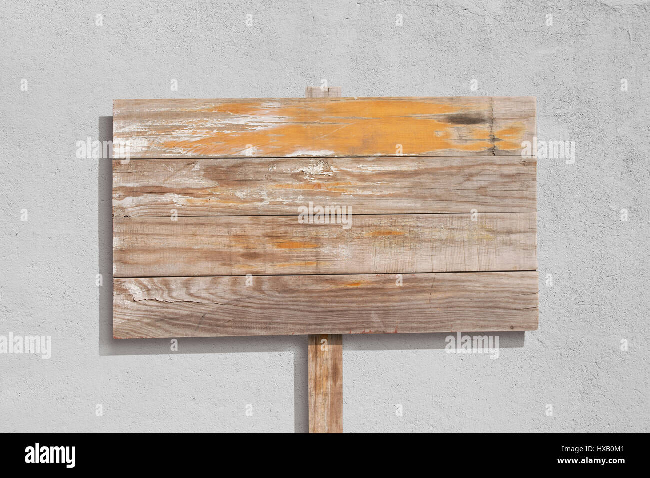 Old vintage wood sign with rough wall background Stock Photo - Alamy