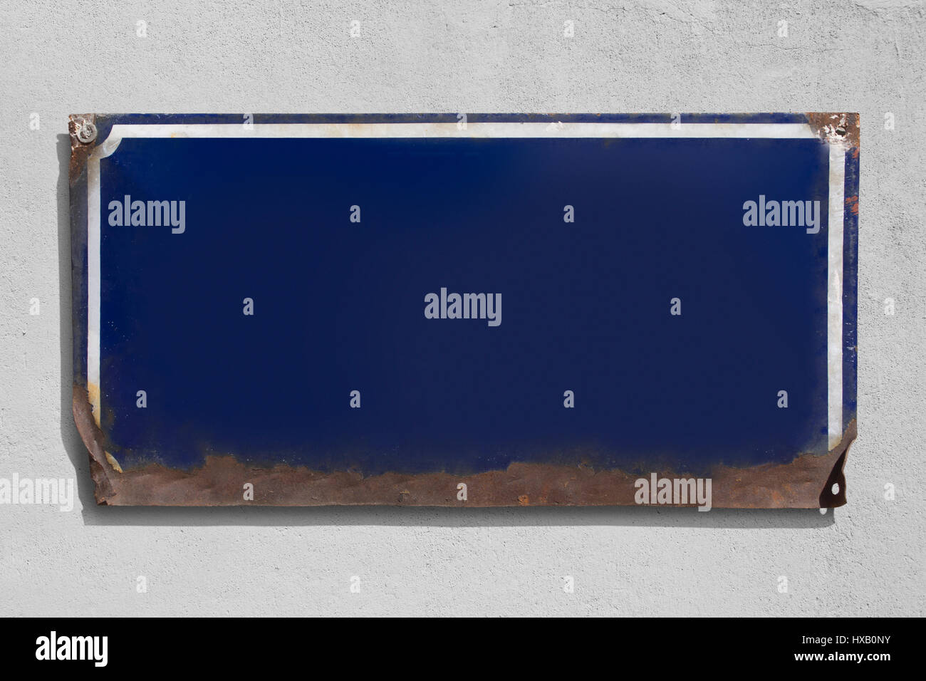 Old rusty vintage blue sign with grey background Stock Photo - Alamy