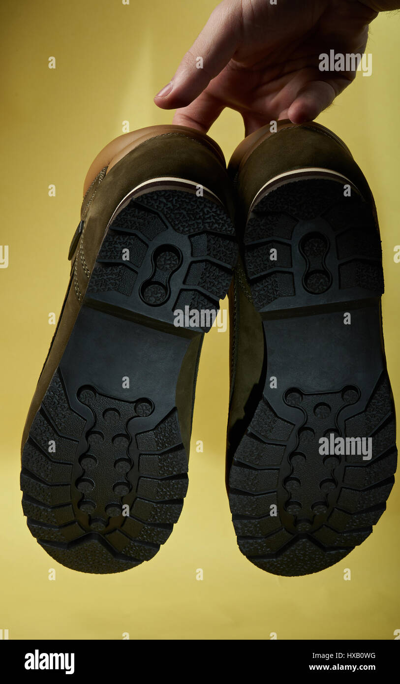 Man hanging by one arm hi-res stock photography and images - Alamy