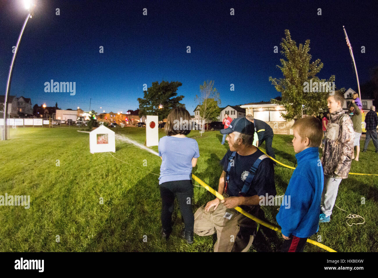 Slinger Fire Department Fire Safety Night hoseline practice Stock Photo ...