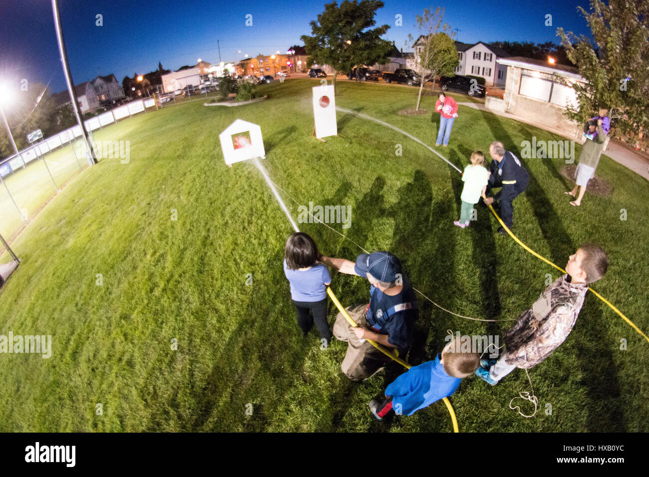 Slinger Fire Department Fire Safety Night hoseline practice Stock Photo ...
