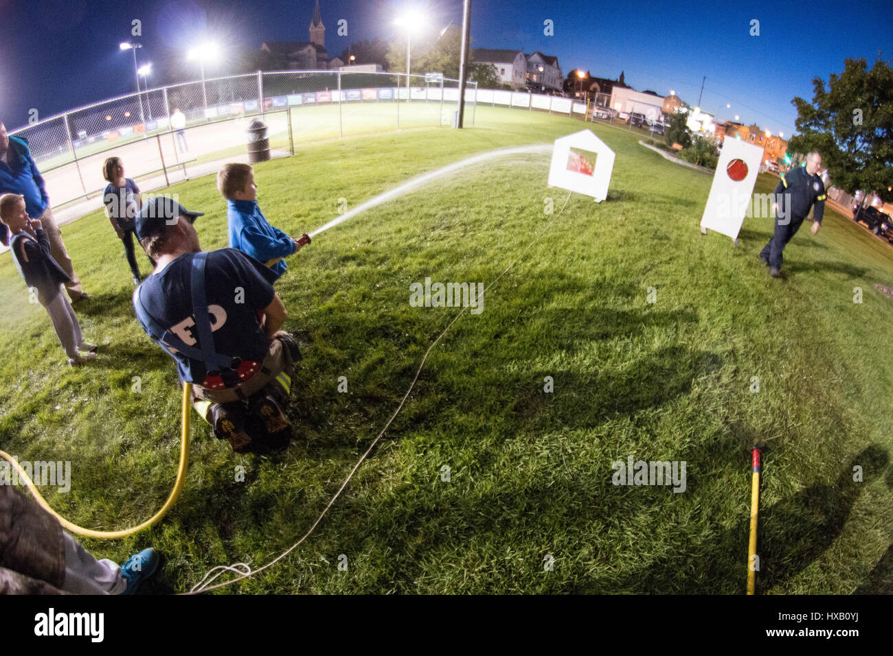 Slinger Fire Department Fire Safety Night hoseline practice Stock Photo ...
