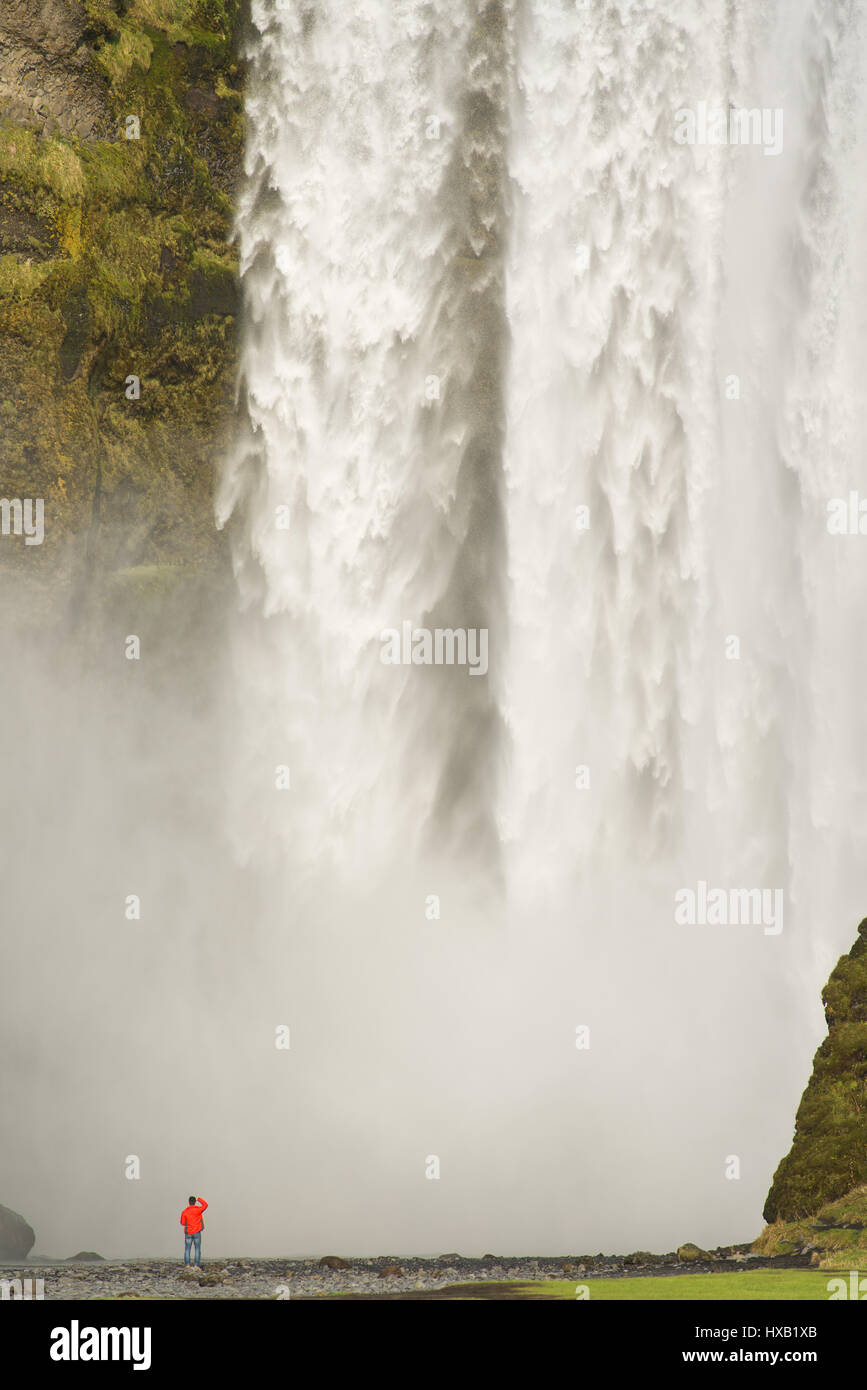 Person standing waterfall hi-res stock photography and images - Alamy