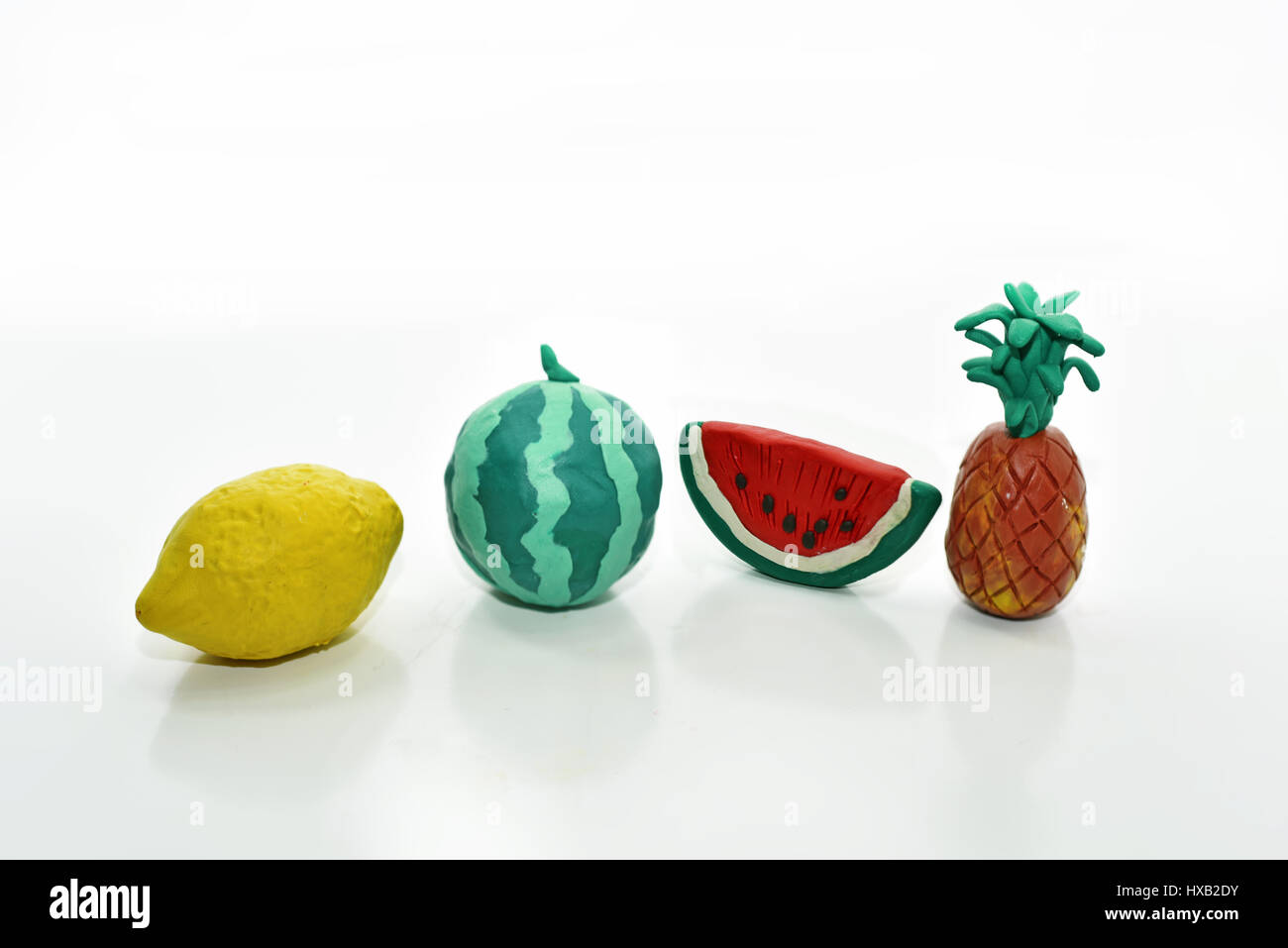 Fruits from plasticine. Isolated on white background Stock Photo - Alamy