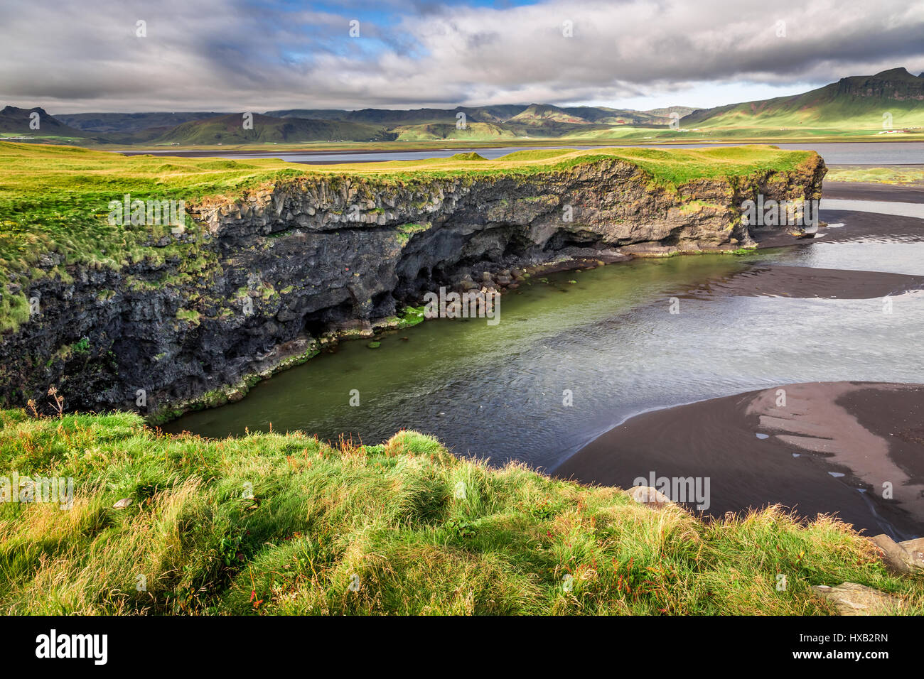 Cliffs and small bay in Iceland in summer Stock Photo - Alamy