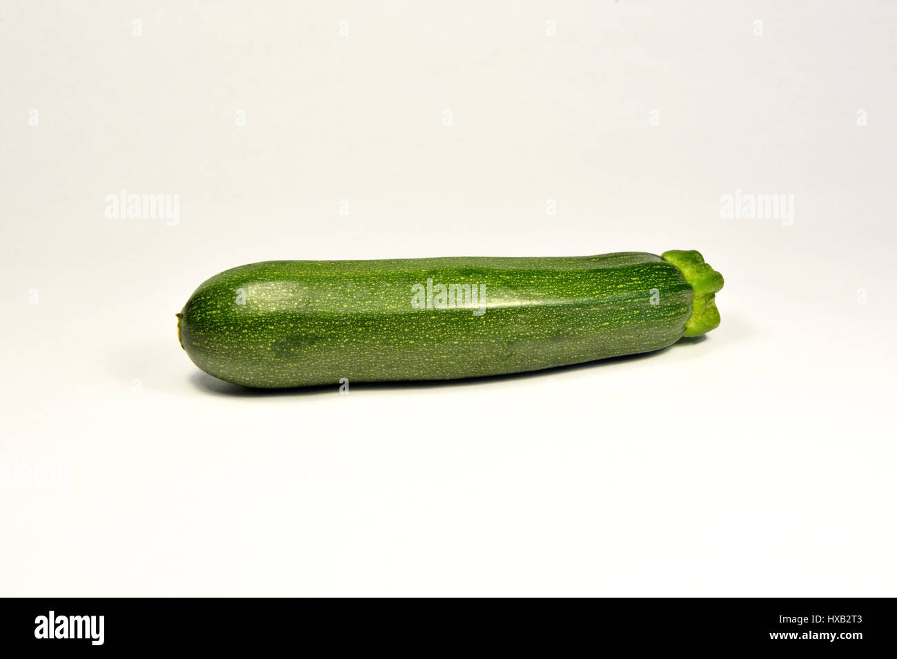 Organic fresh zucchini isolated on white background Stock Photo - Alamy