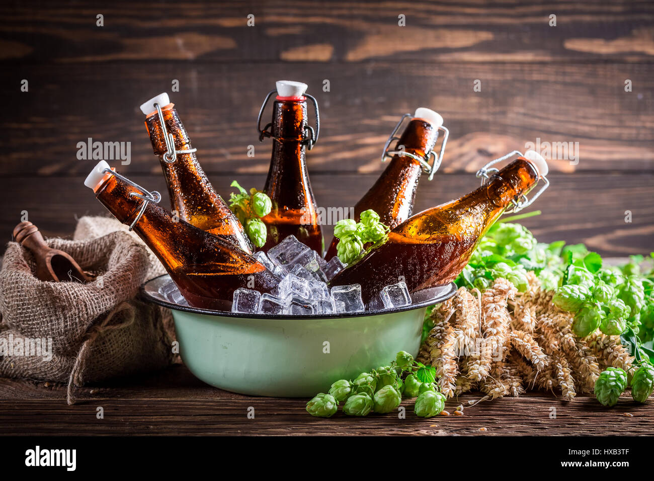 Cold and fresh beer on ice cubes Stock Photo - Alamy