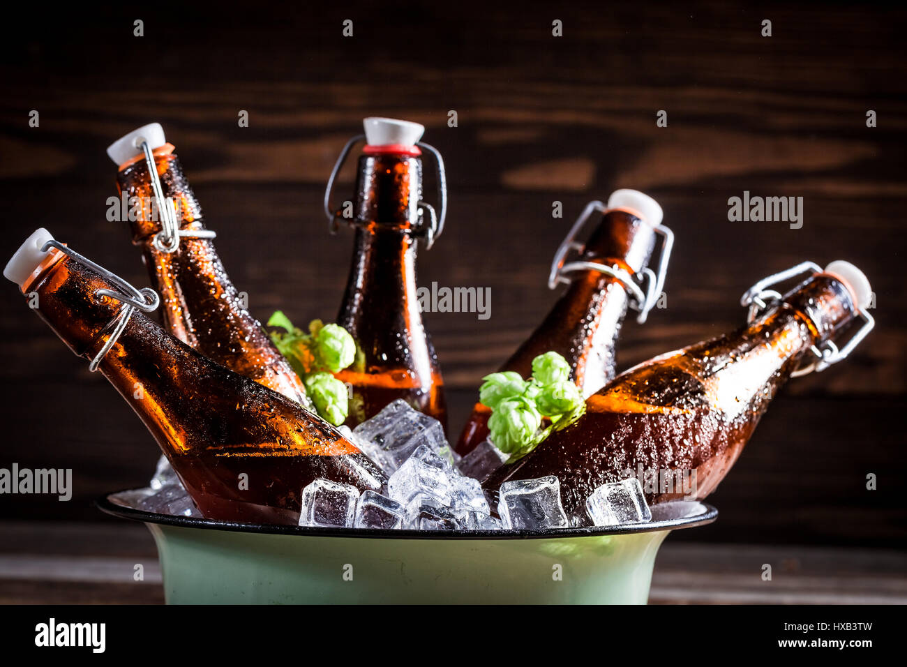 Cold and fresh cider beer on ice cubes Stock Photo - Alamy