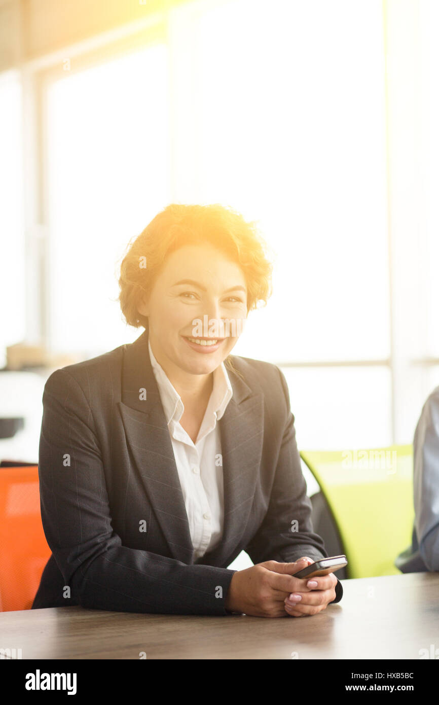 Kind business woman in office Stock Photo - Alamy