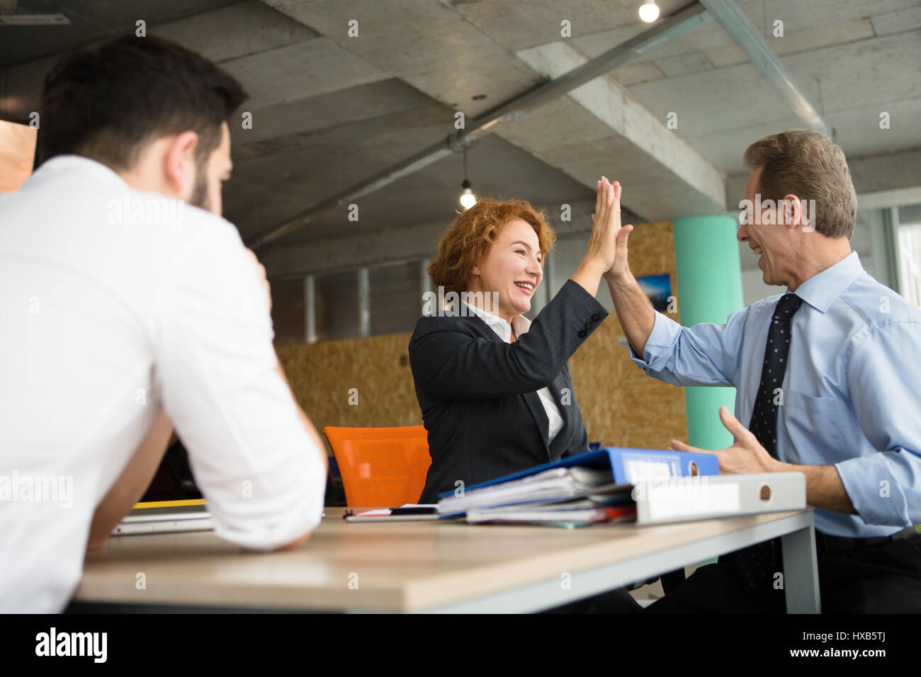 Happy employees in office Stock Photo - Alamy