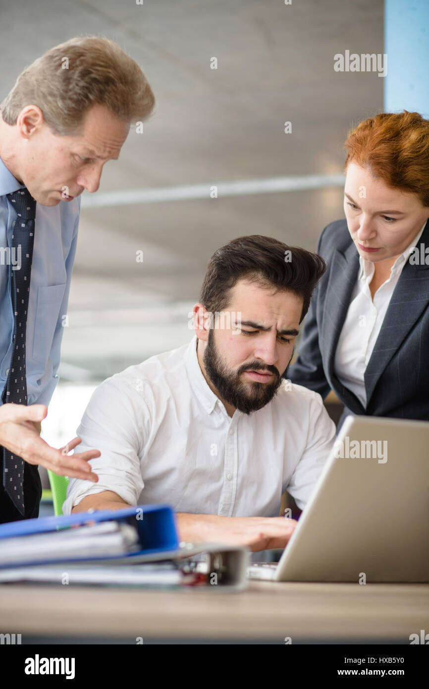 Angry boss screaming at workers Stock Photo - Alamy