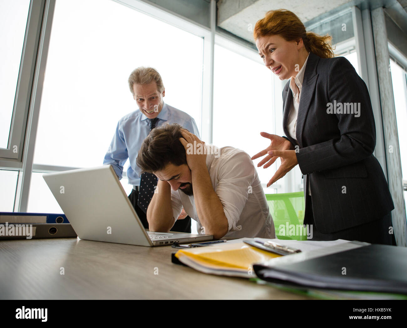 Angry boss screaming at workers Stock Photo - Alamy