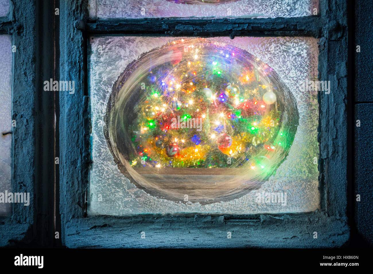 Christmas tree in home view from frozen window Stock Photo - Alamy