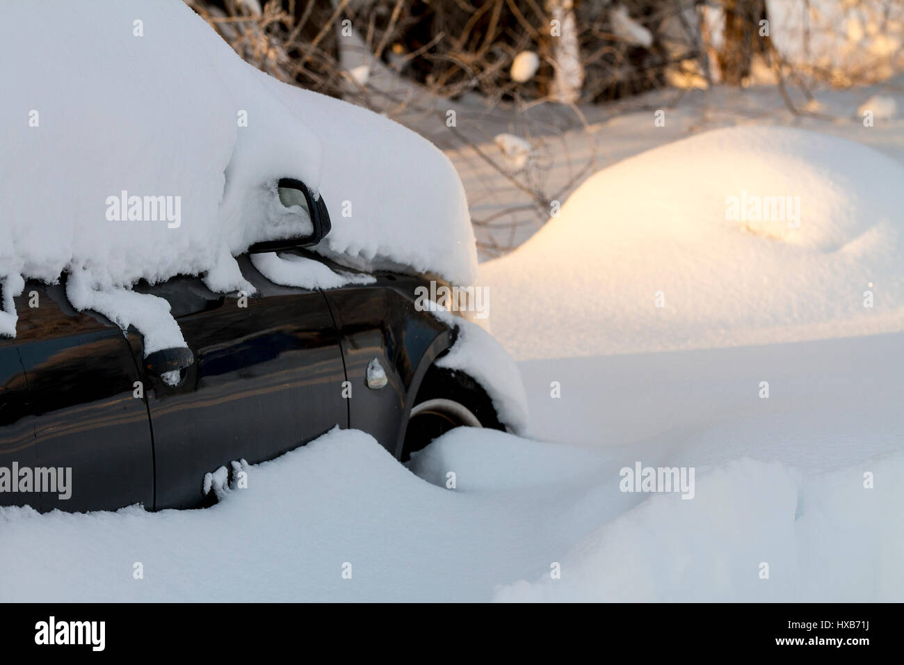 Snow covered car from a heavy winter Stock Photo - Alamy