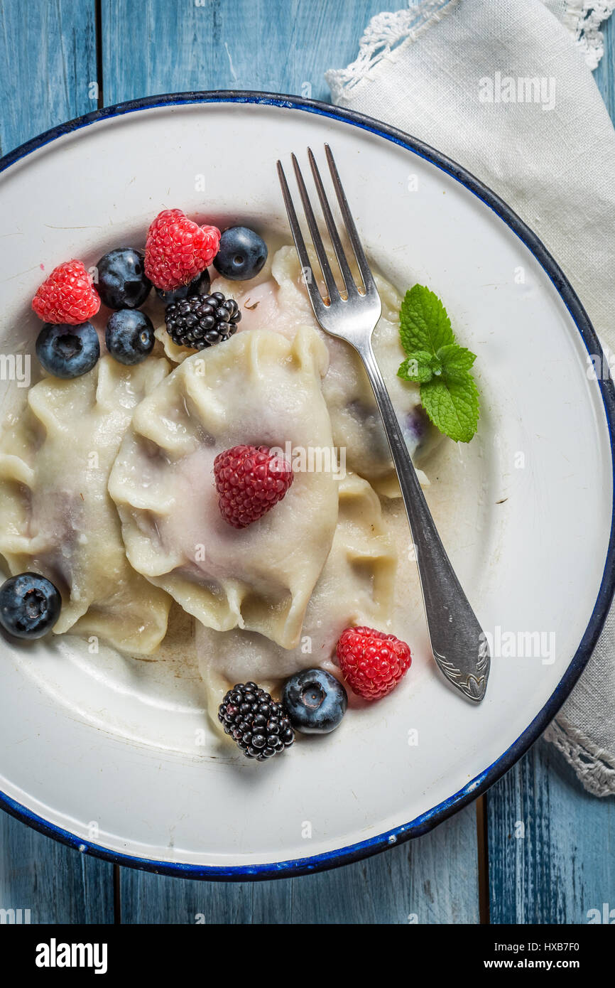 Sweet dumplings with blueberry, blackberry and raspberry Stock Photo ...