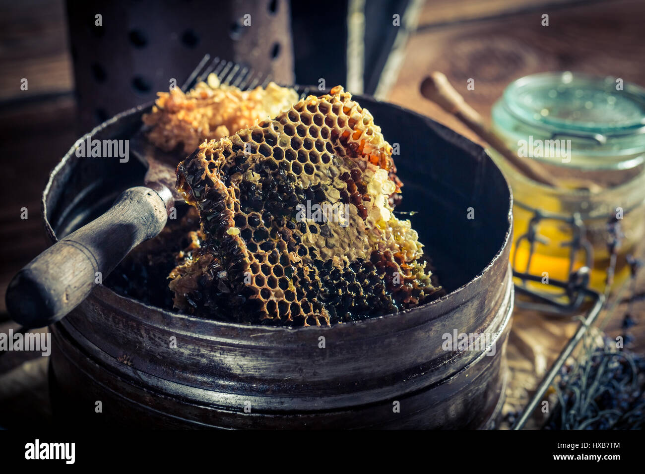 Vintage beekeeper tools with honey on old wooden table Stock Photo - Alamy