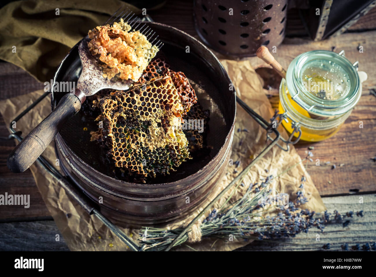 Age beekeeper tools in workshop on old wooden table Stock Photo - Alamy