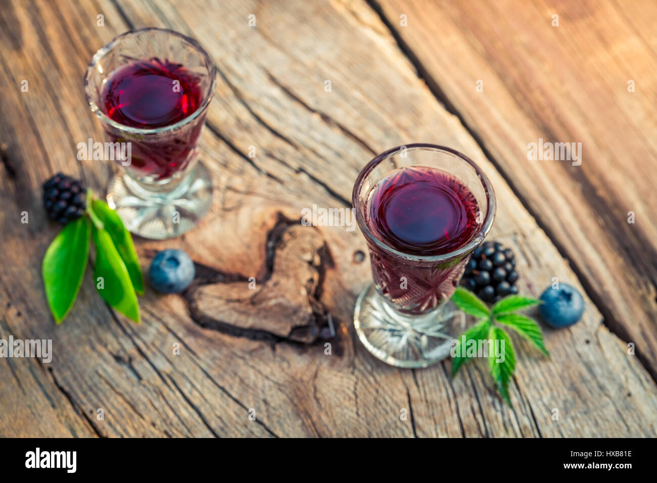 Homemade liqueur with alcohol and berry fruits Stock Photo - Alamy