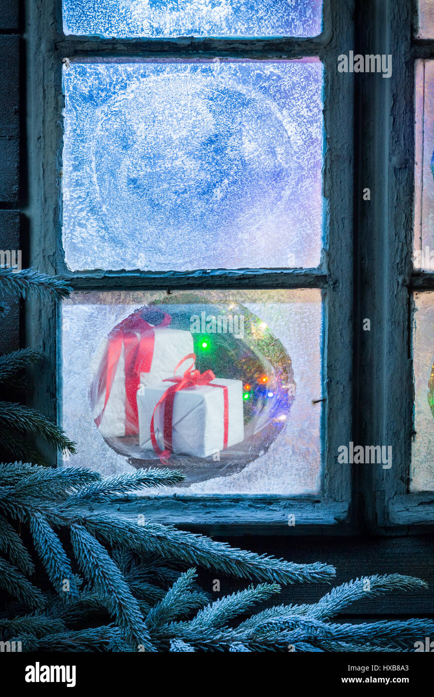 Christmas tree view from frozen window at night Stock Photo - Alamy
