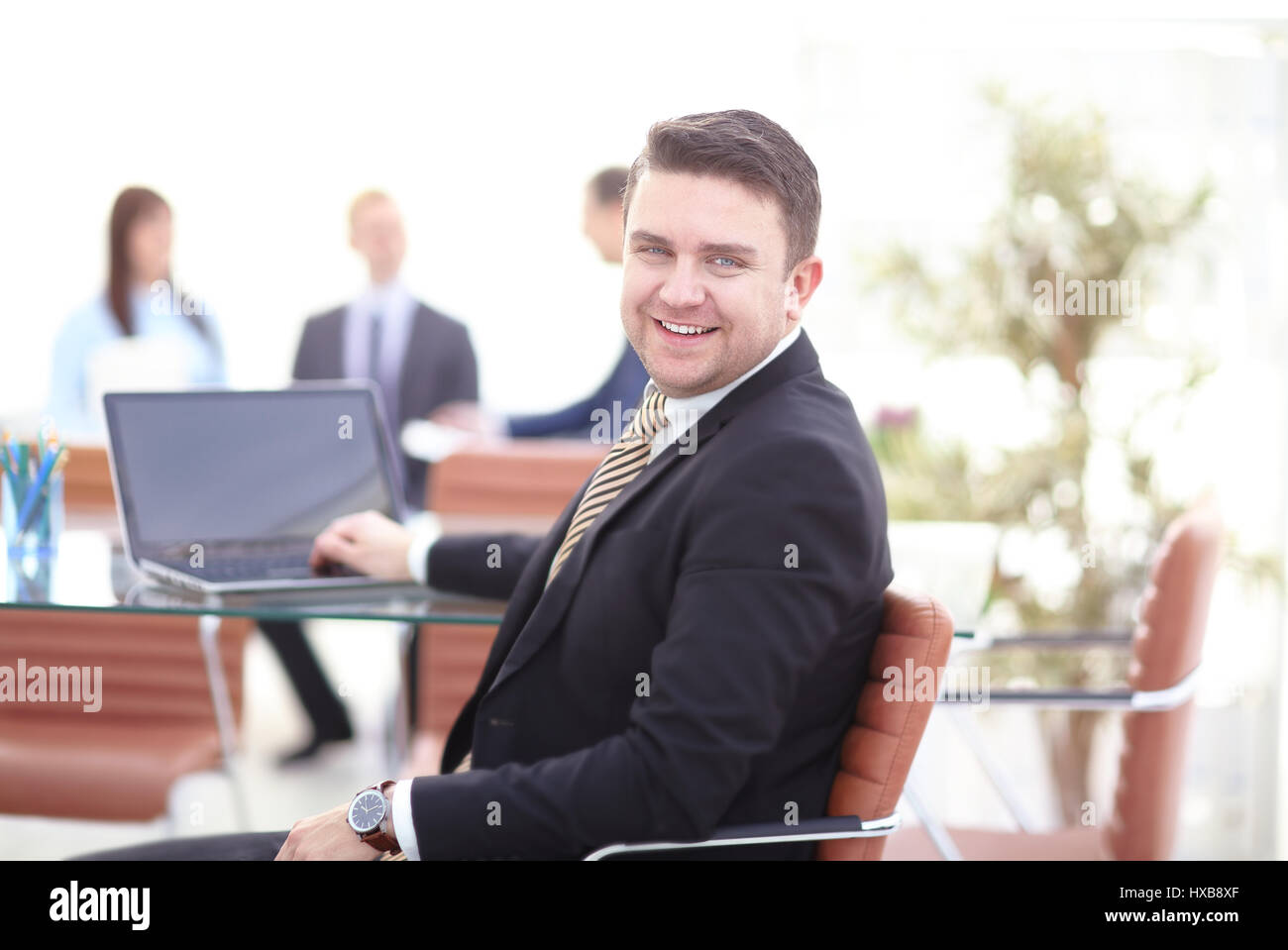 Employee looking at computer monitor during working day Stock Photo - Alamy