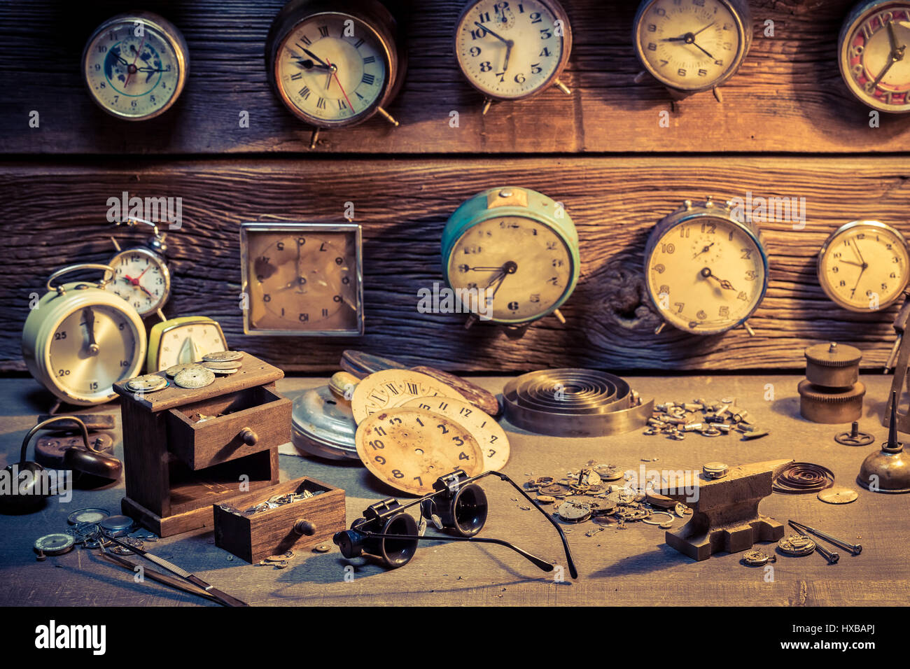 Watchmaker's workshop with parts of clocks Stock Photo - Alamy